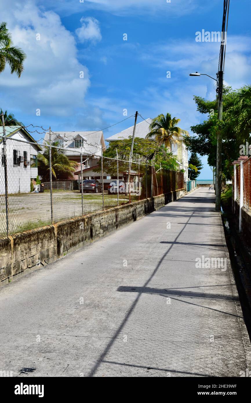 A side street leading to the sea in Belize City, Belize Stock Photo - Alamy