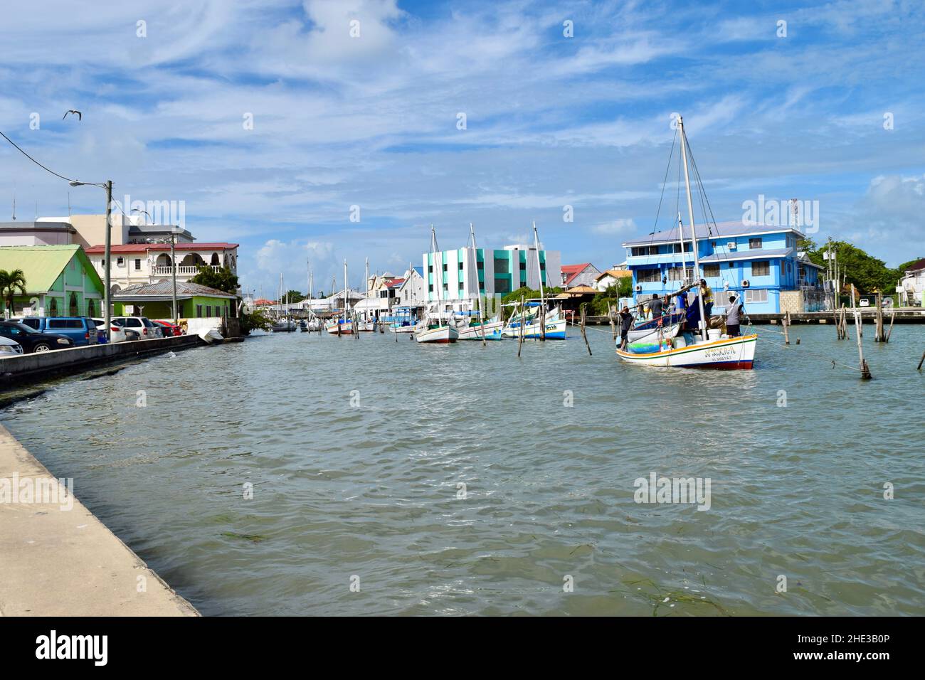 Fishermen going out to sea from the Belize City harbour Stock Photo - Alamy