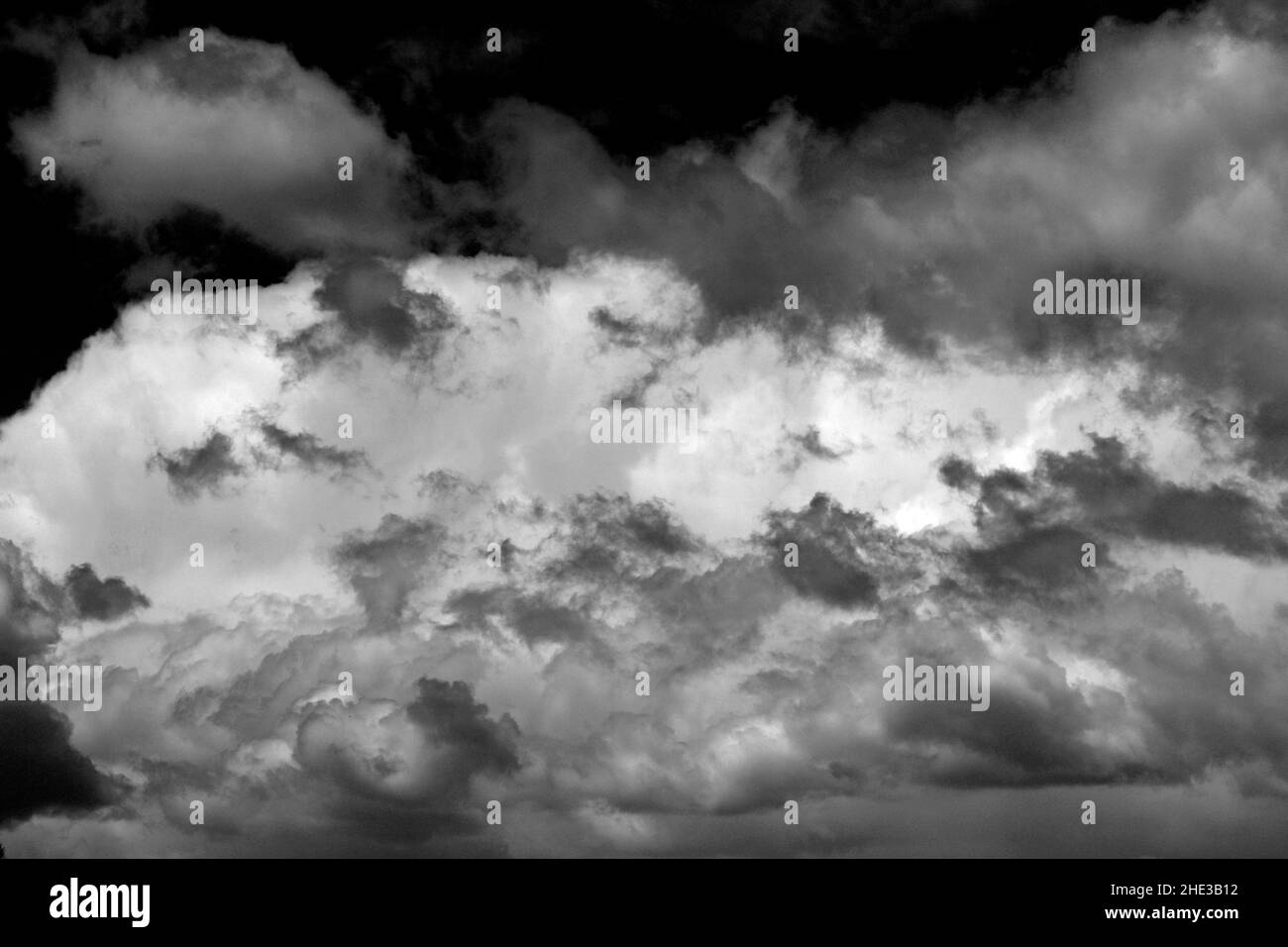 Darkening cumulus clouds form in the sky over the American Southwest ...