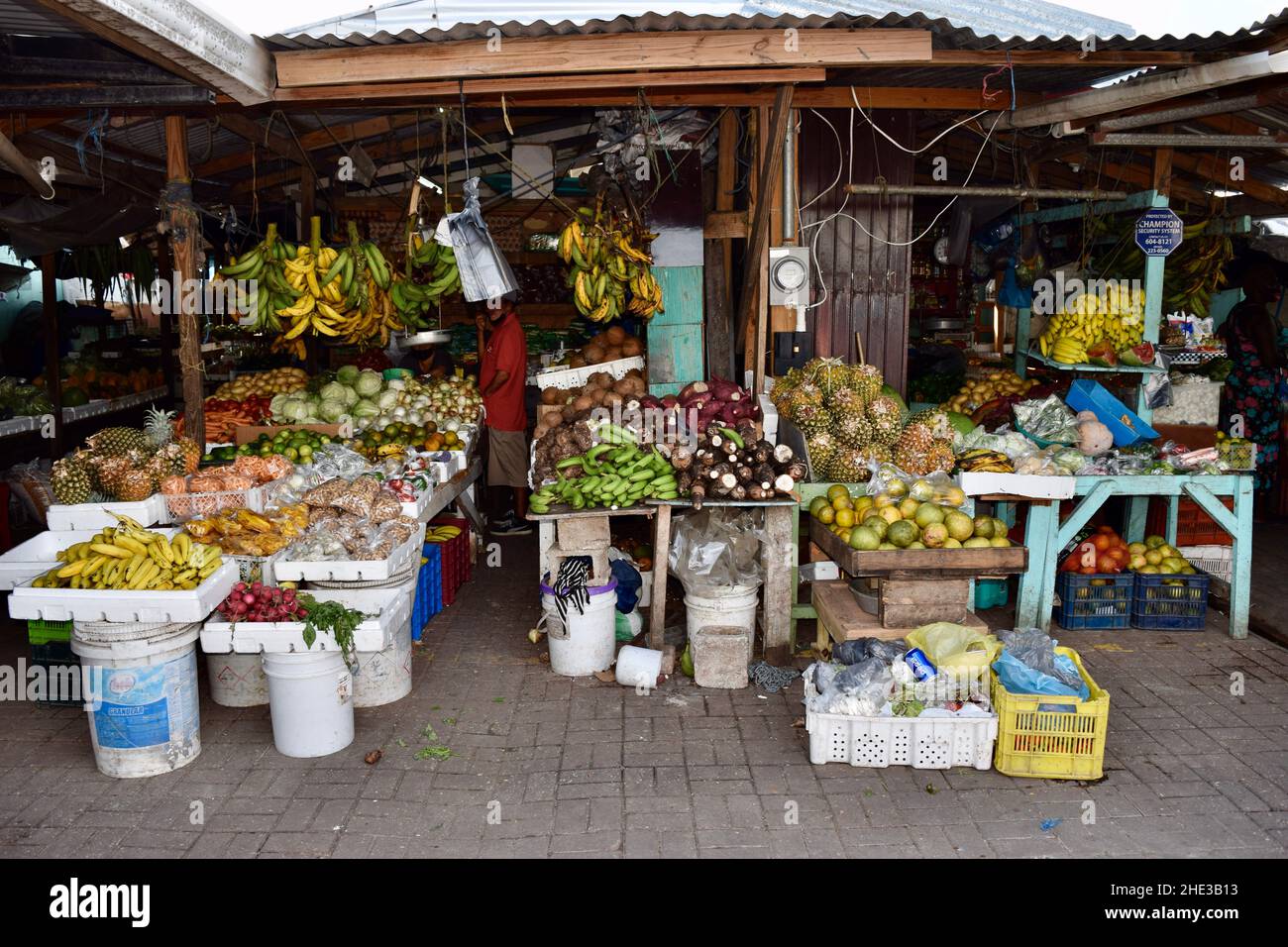 A large stall of fresh vegetables at the entrance to the Belize City ...
