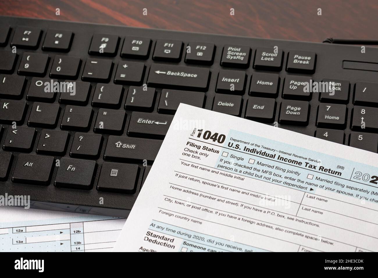 Income tax return and computer keyboard. Online filing, tax software ...