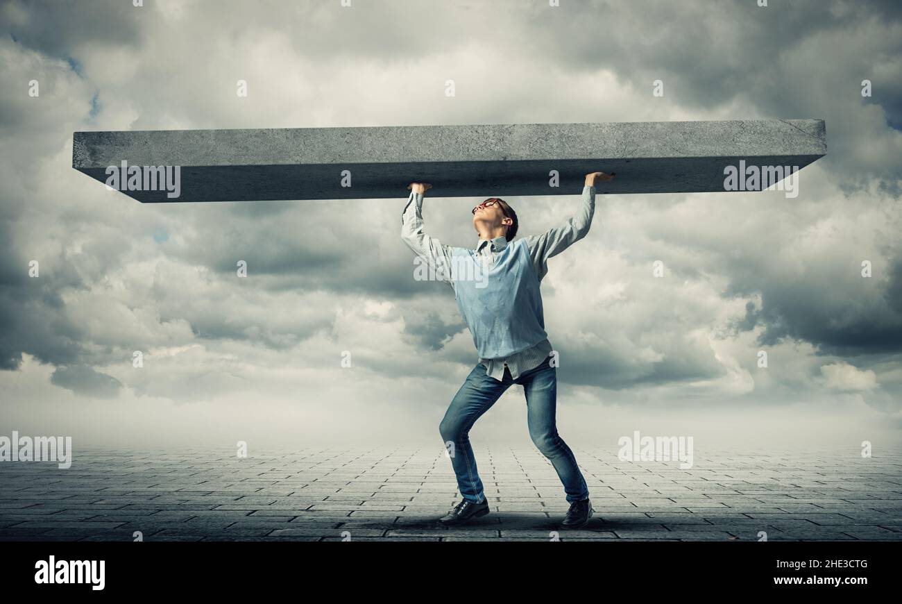 Guy lifting cement banner Stock Photo - Alamy