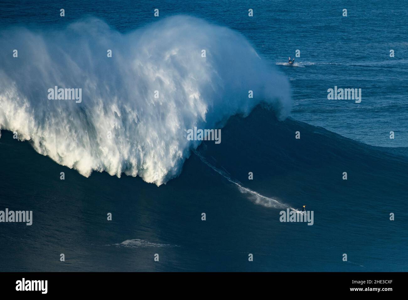 A surfer seen riding a big wave at Praia do Norte Beach in Nazare.First ...