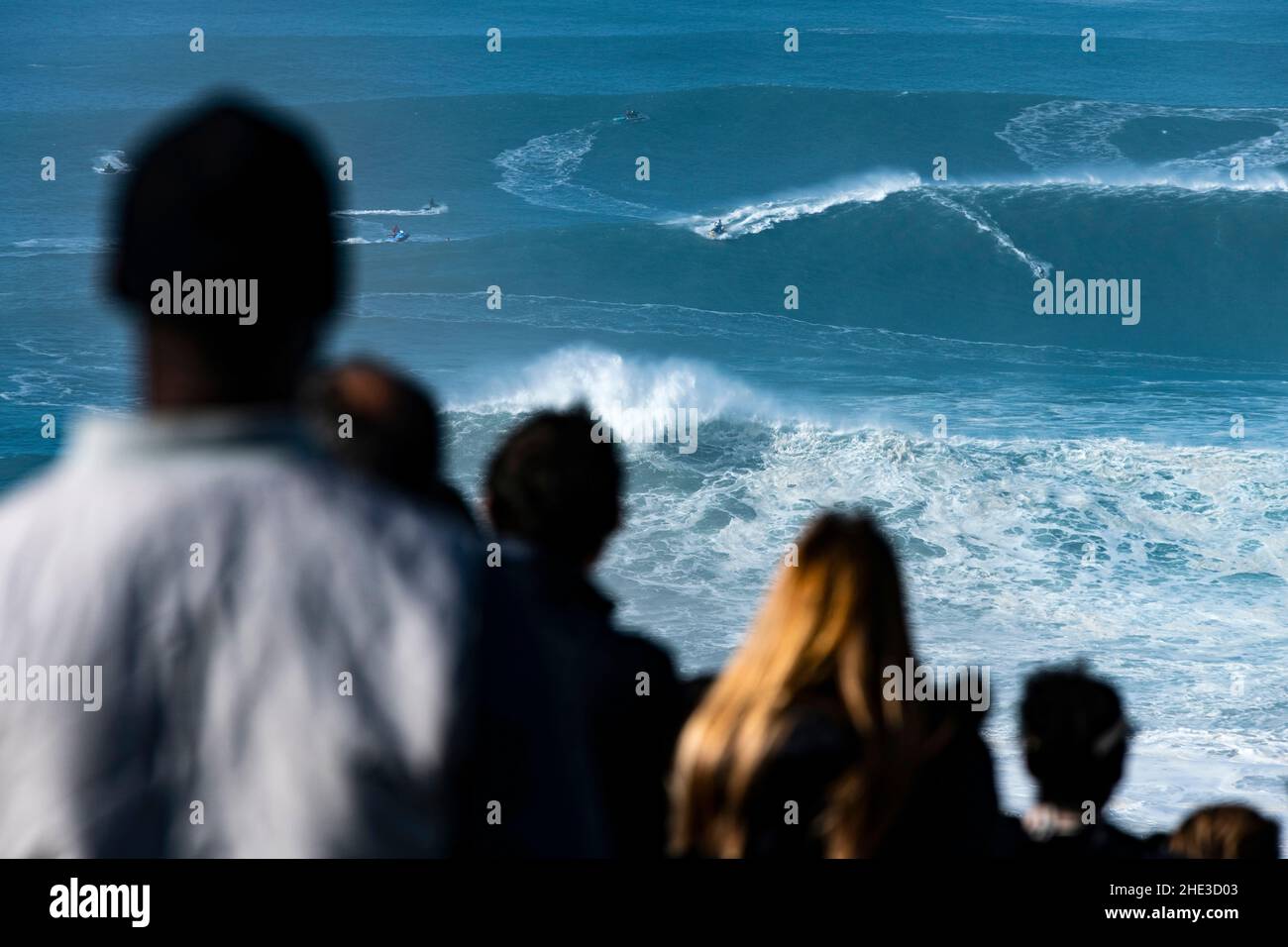 A surfer seen riding a big wave at Praia do Norte Beach in Nazare.First ...