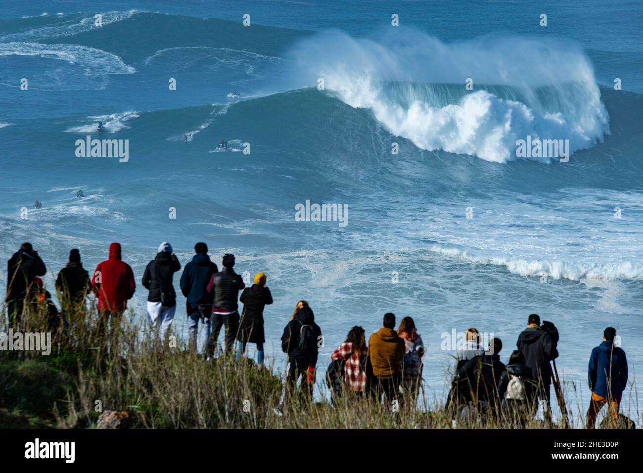 A surfer seen riding a big wave at Praia do Norte Beach in Nazare.First ...