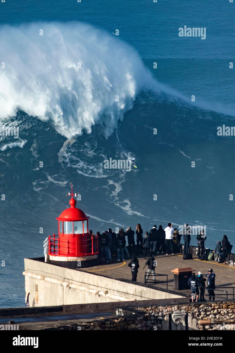 A surfer seen riding a big wave at Praia do Norte Beach in Nazare.First ...