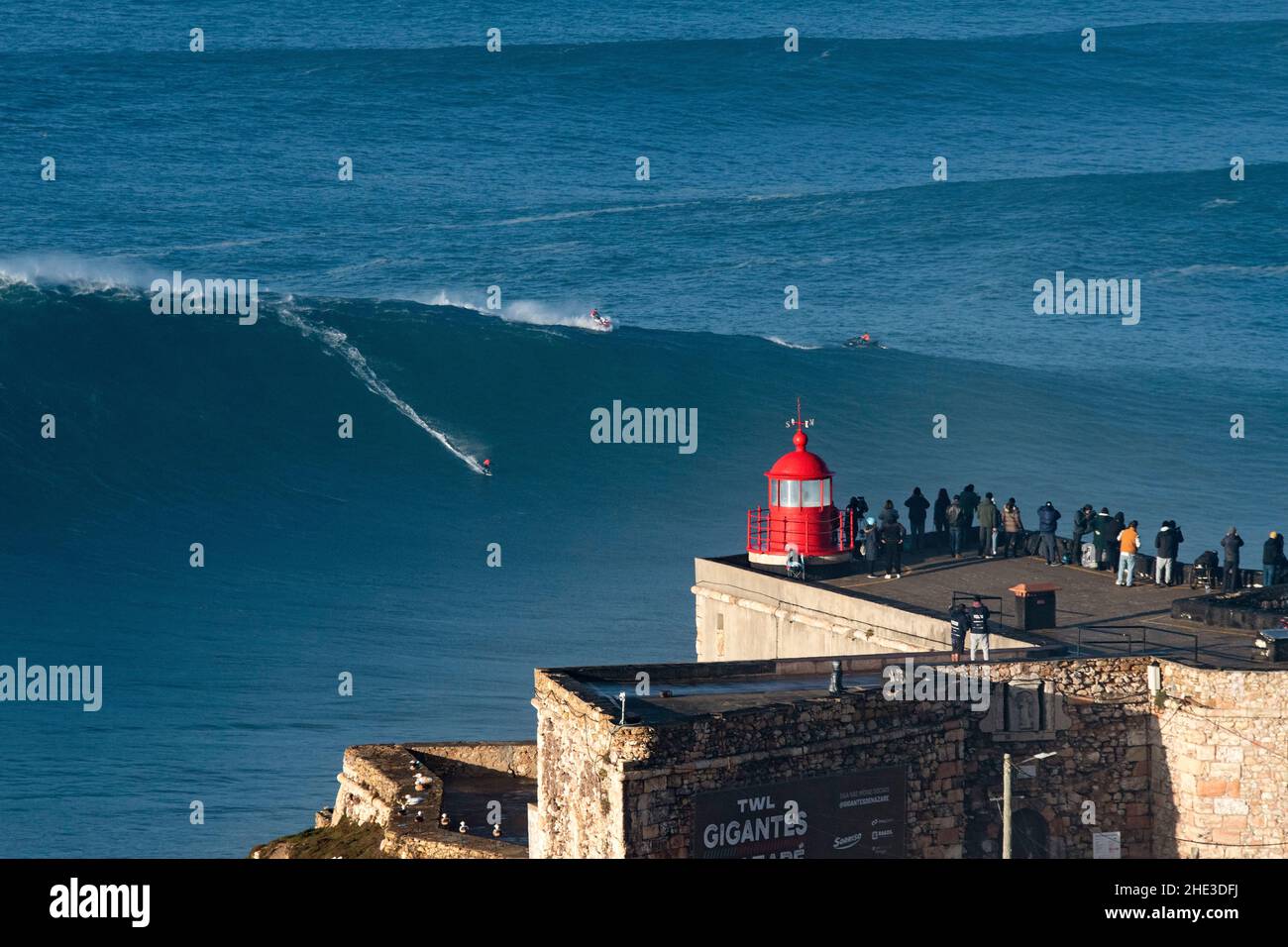A surfer seen riding a big wave at Praia do Norte Beach in Nazare.First ...