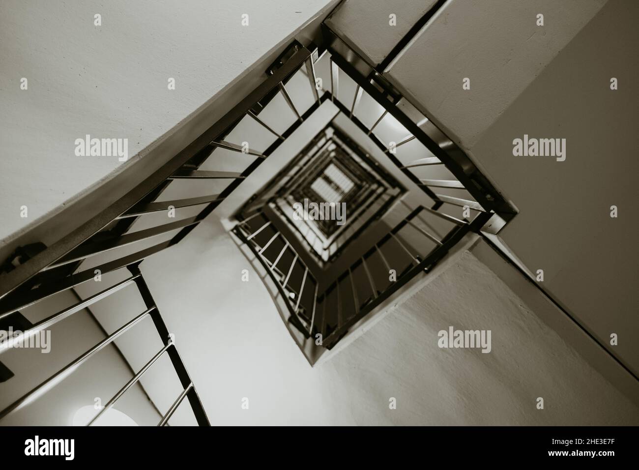 Abstract interior fragment of square shaped flight of stairs in modern ...