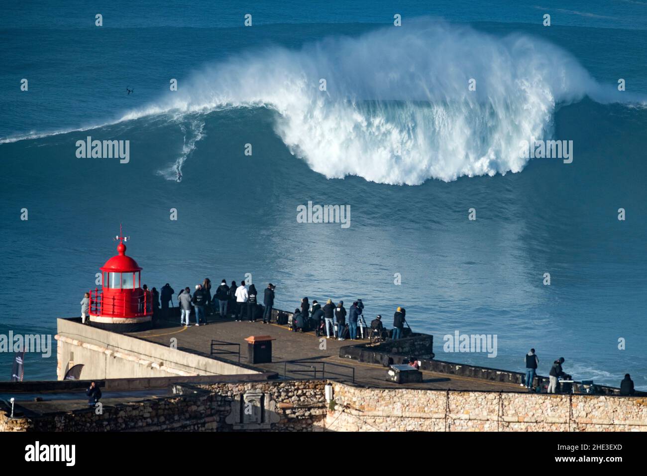 A surfer seen riding a big wave at Praia do Norte Beach in Nazare.First ...