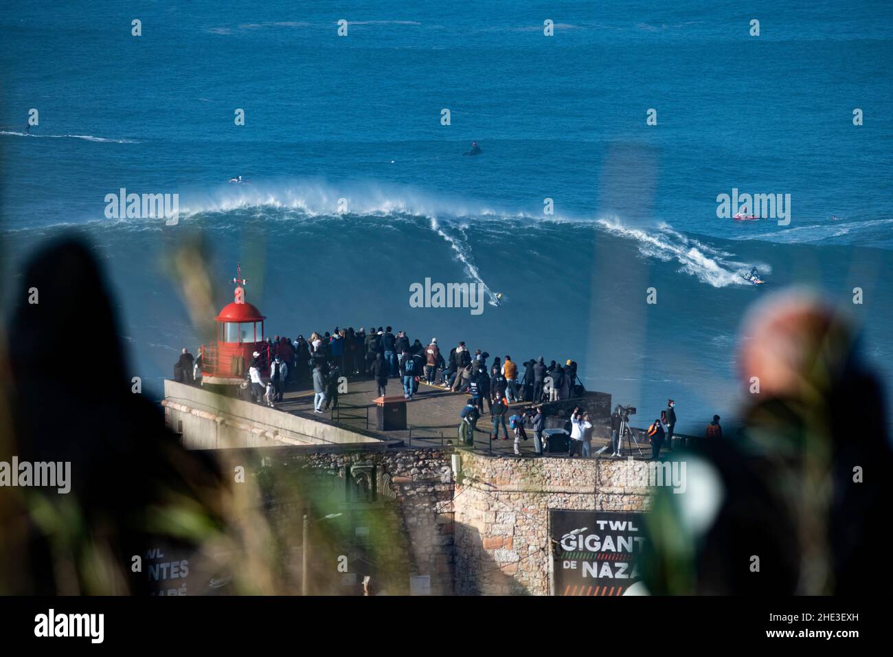 A surfer seen riding a big wave at Praia do Norte Beach in Nazare.First ...