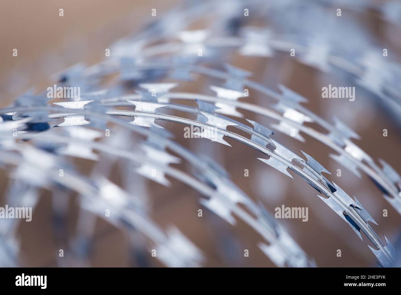 Closeup focus view of NATO barb wire with sharp and dangerous razor ...