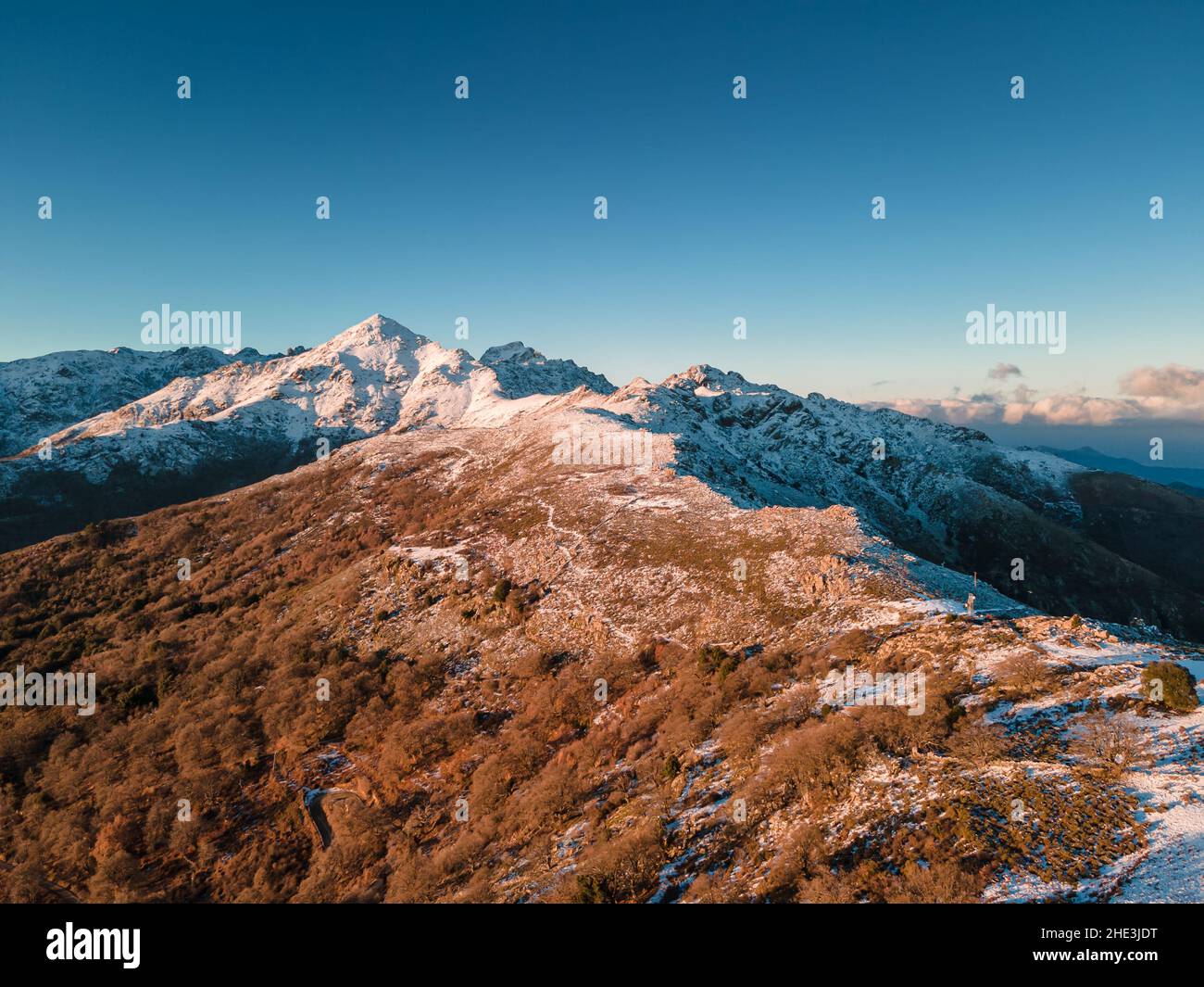 Aerial view of a ridge at the Col de Battaglia leading towards the snow ...