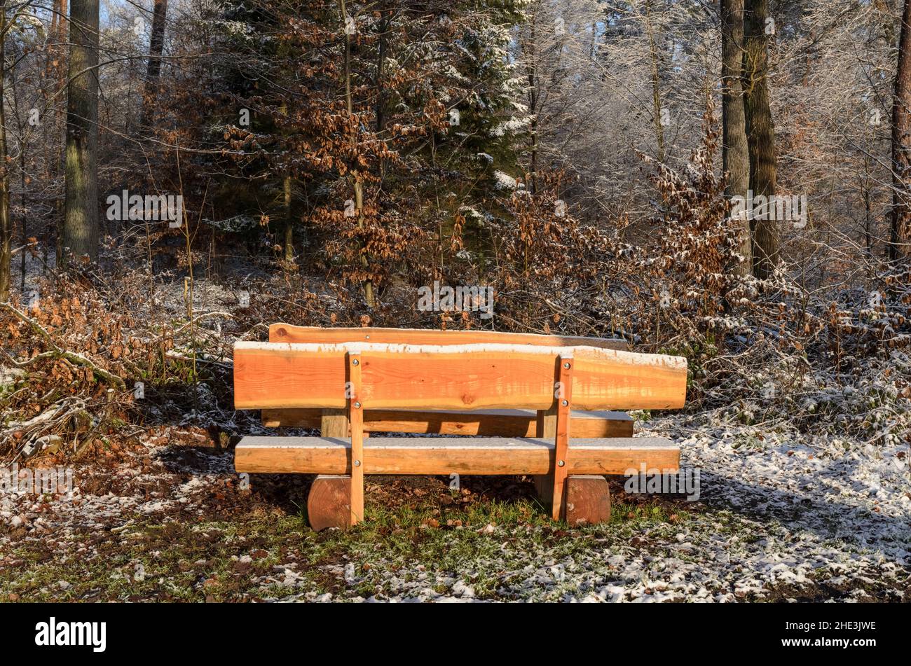 Wooden benches and picknick table along a hiking trail in the ...