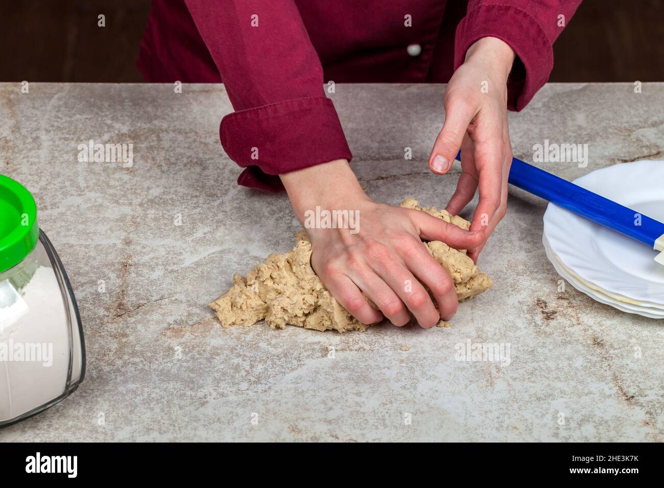 The process of preparing a homogeneous mass of dough for baking Stock ...