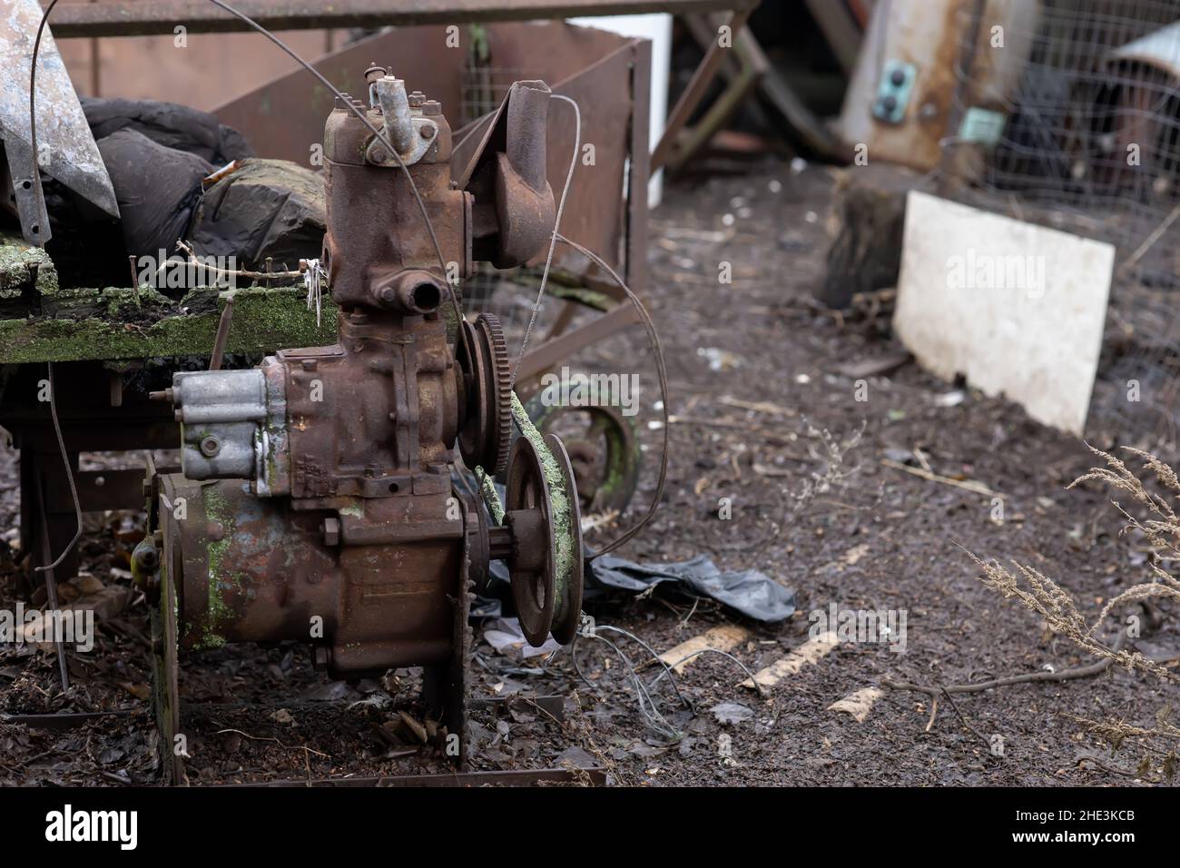 an old rusty motor is scrap metal on the farmyard Stock Photo - Alamy