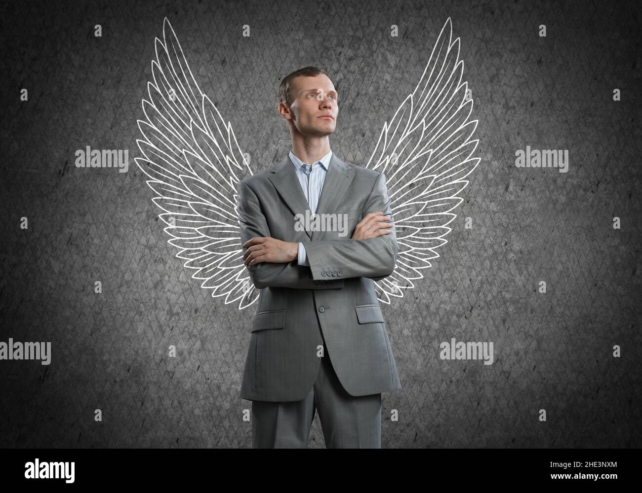 Businessman with wings Stock Photo - Alamy