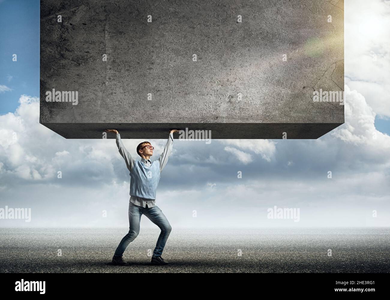 Guy lifting cement banner Stock Photo - Alamy
