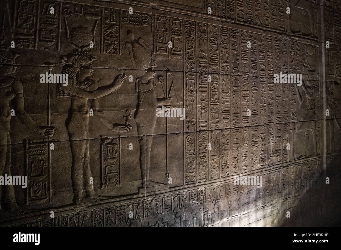 A temple wall in the Philae complex in Egypt. The stone walls are ...