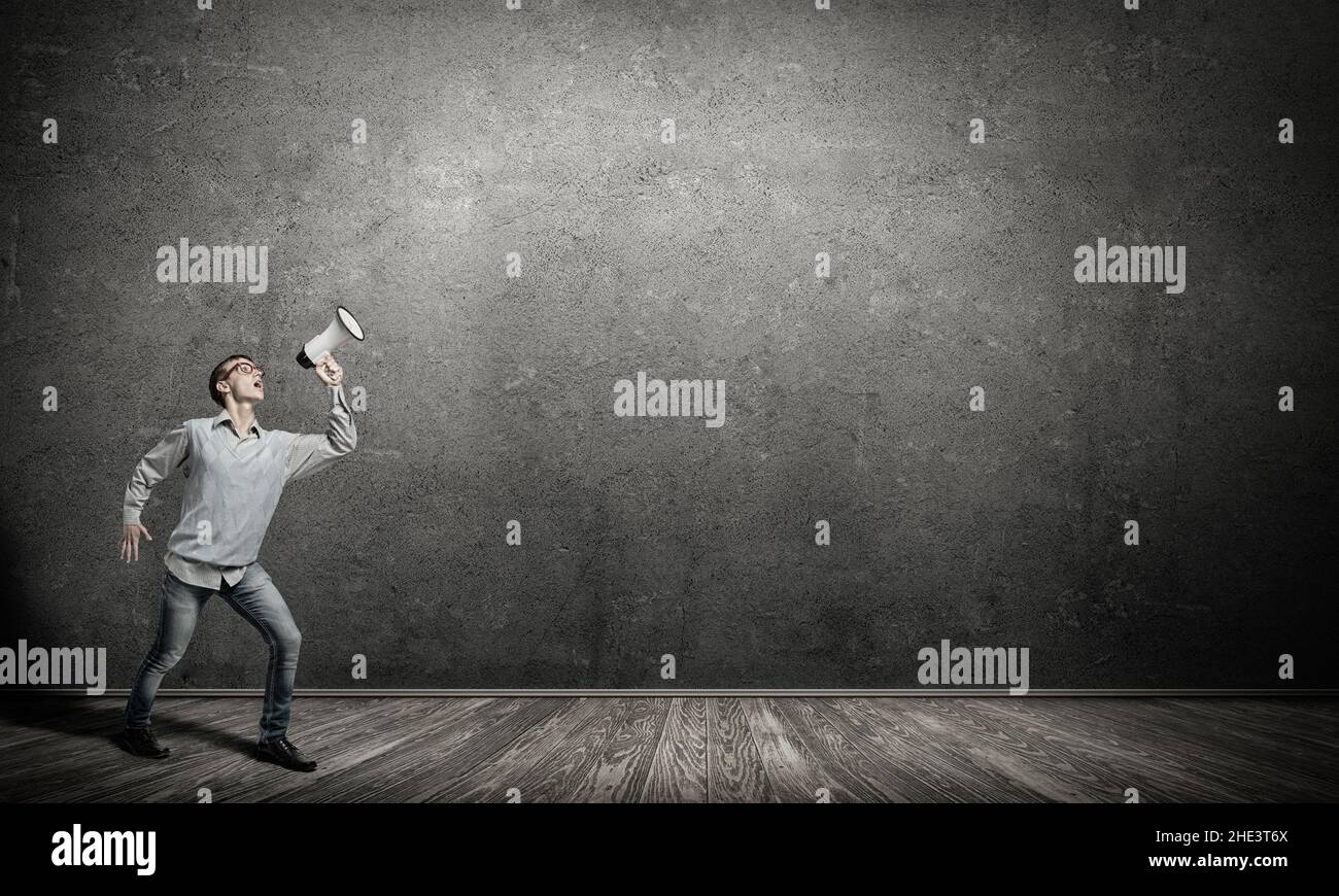 Boy with megaphone Stock Photo - Alamy