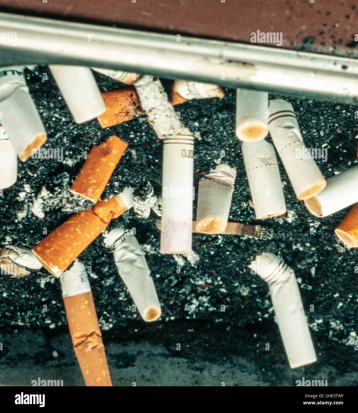 Found lifestyle still life of cigarette butts pattern in an outdoor ...