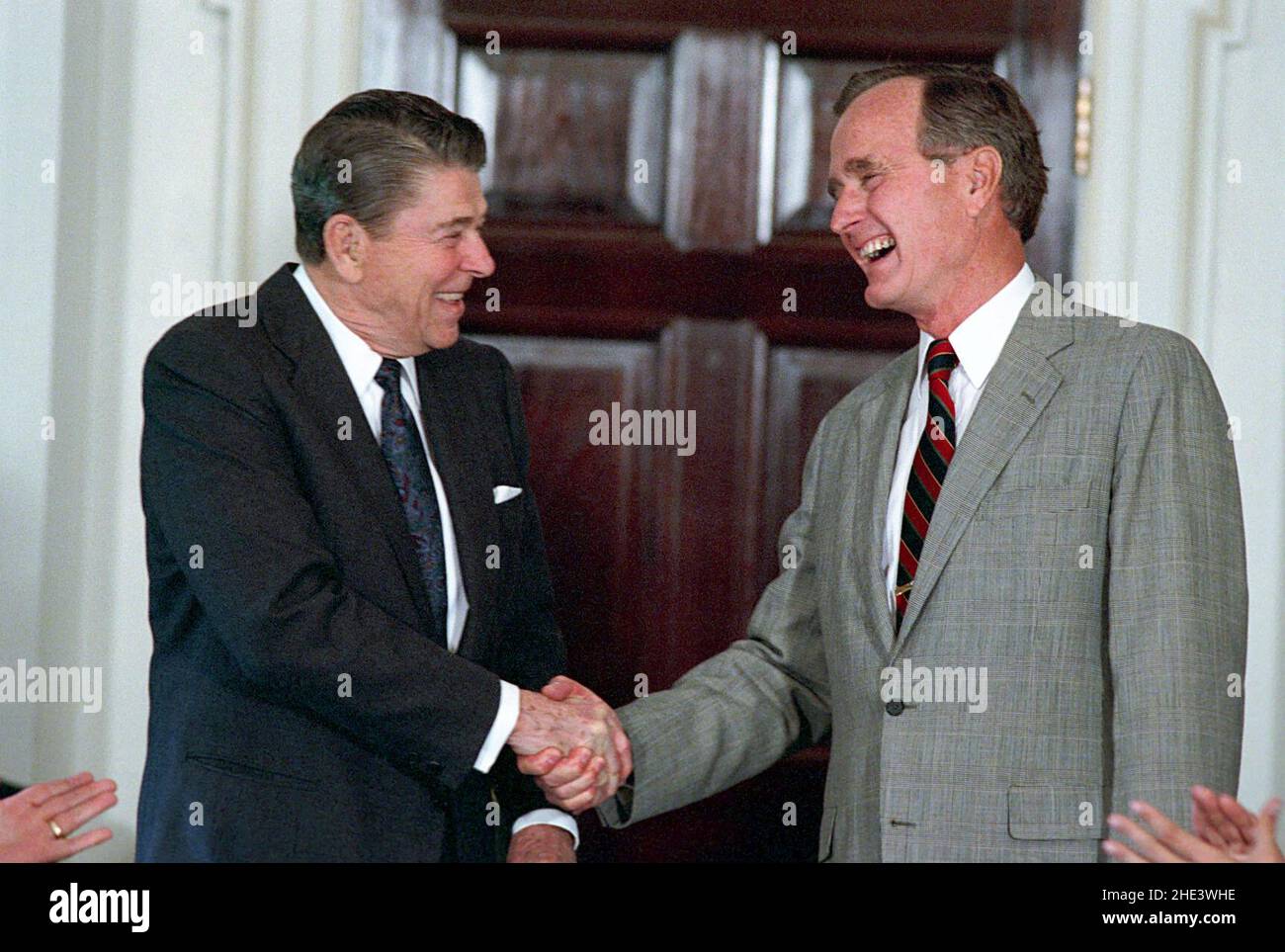 Ronald Reagan meeting with George H. W. Bush in the Cabinet Room Stock ...