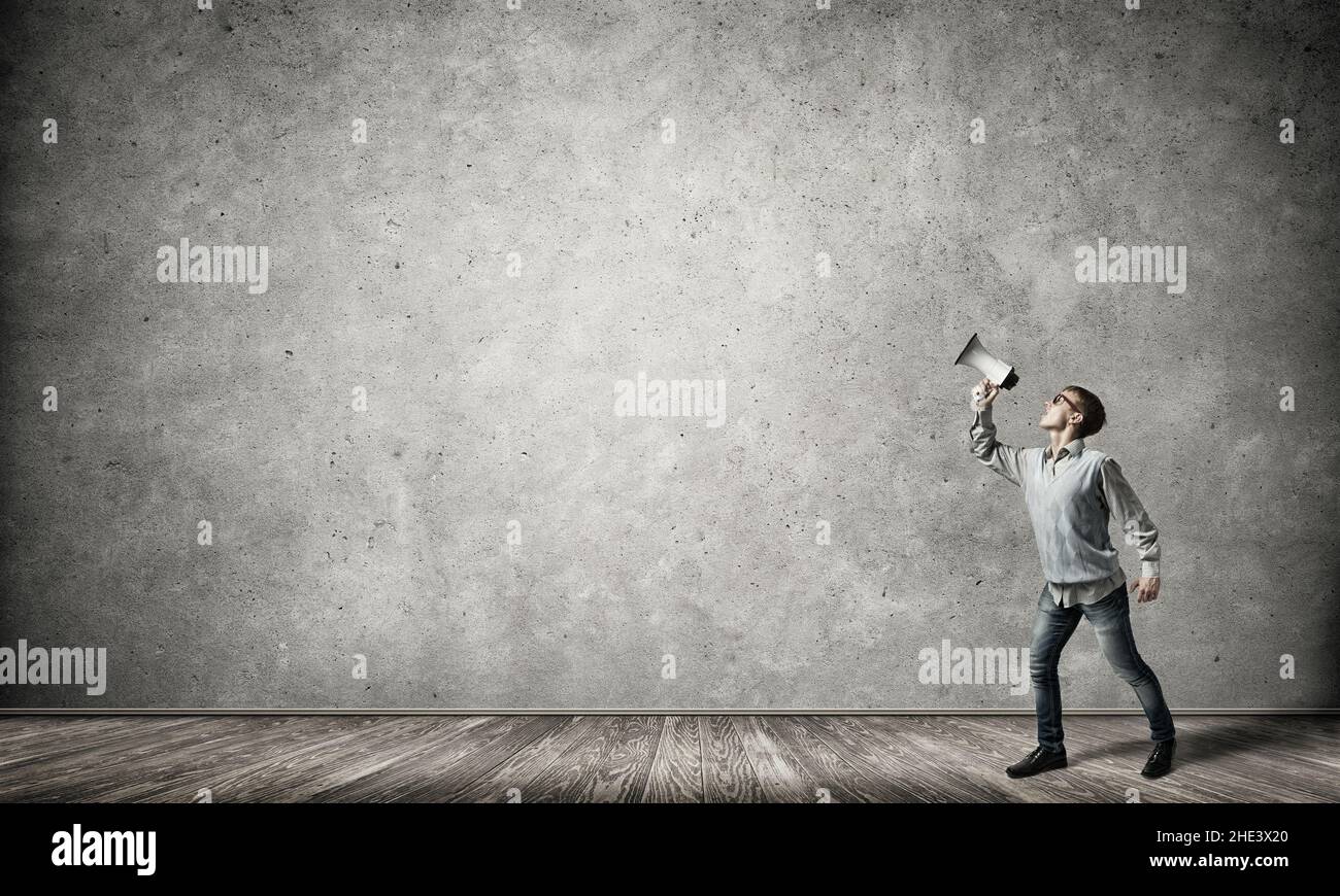 Boy with megaphone Stock Photo - Alamy