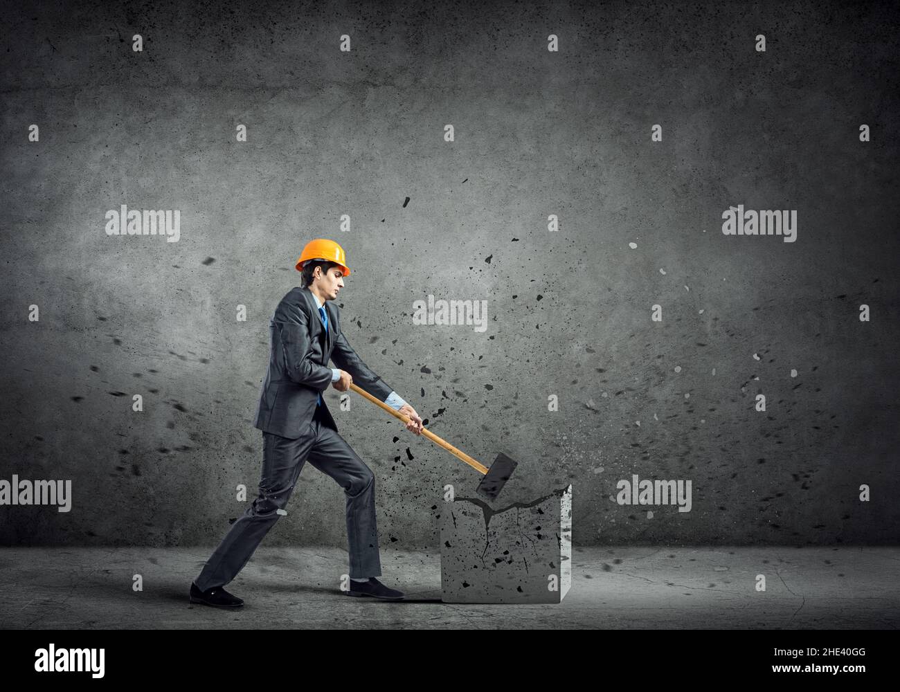 Engineer man break stone Stock Photo - Alamy