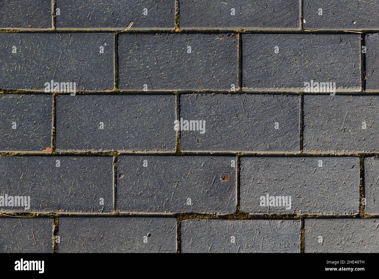 Clinker bricks on the pavement. Stone roads made of dark gray bricks ...