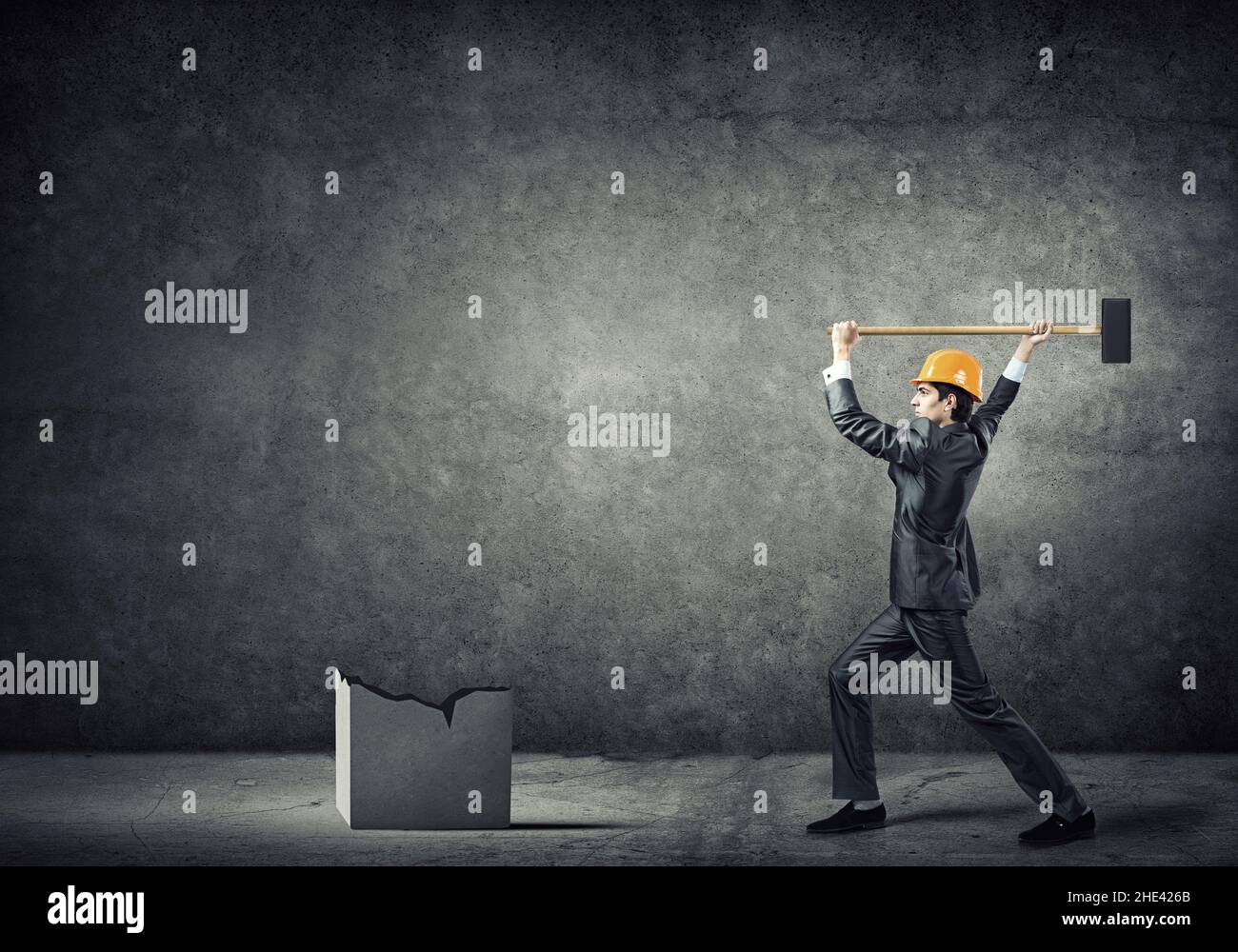 Engineer man break stone Stock Photo - Alamy