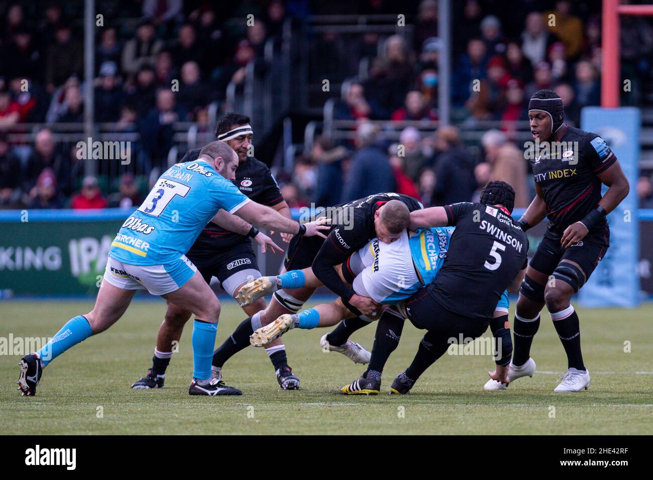 Freddie Clarke #4 of Gloucester Rugby is tackled by Tim Swinson #5 of ...