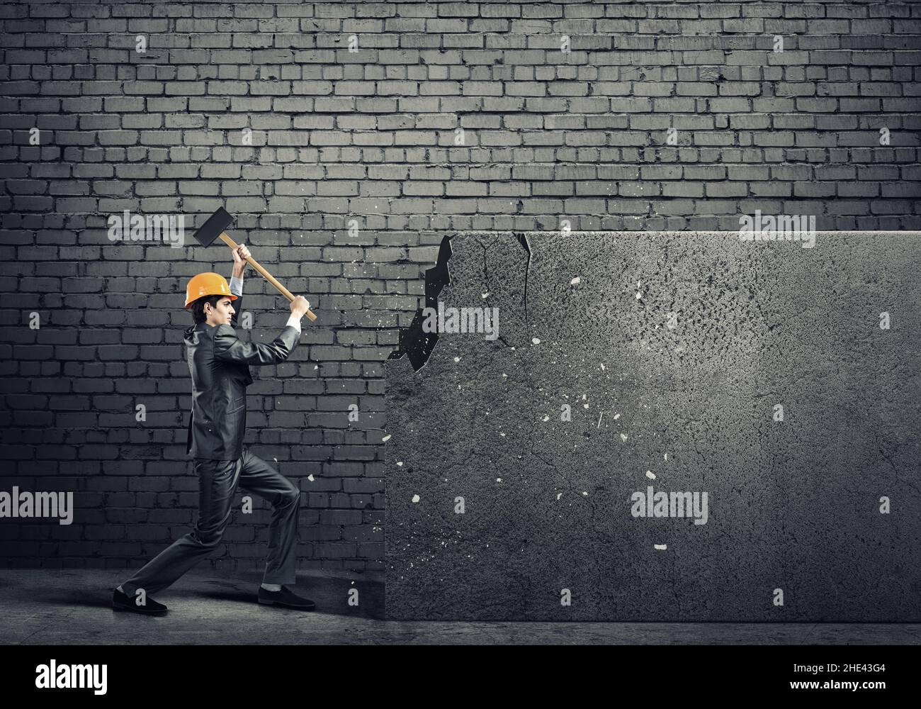 Engineer man break wall Stock Photo - Alamy