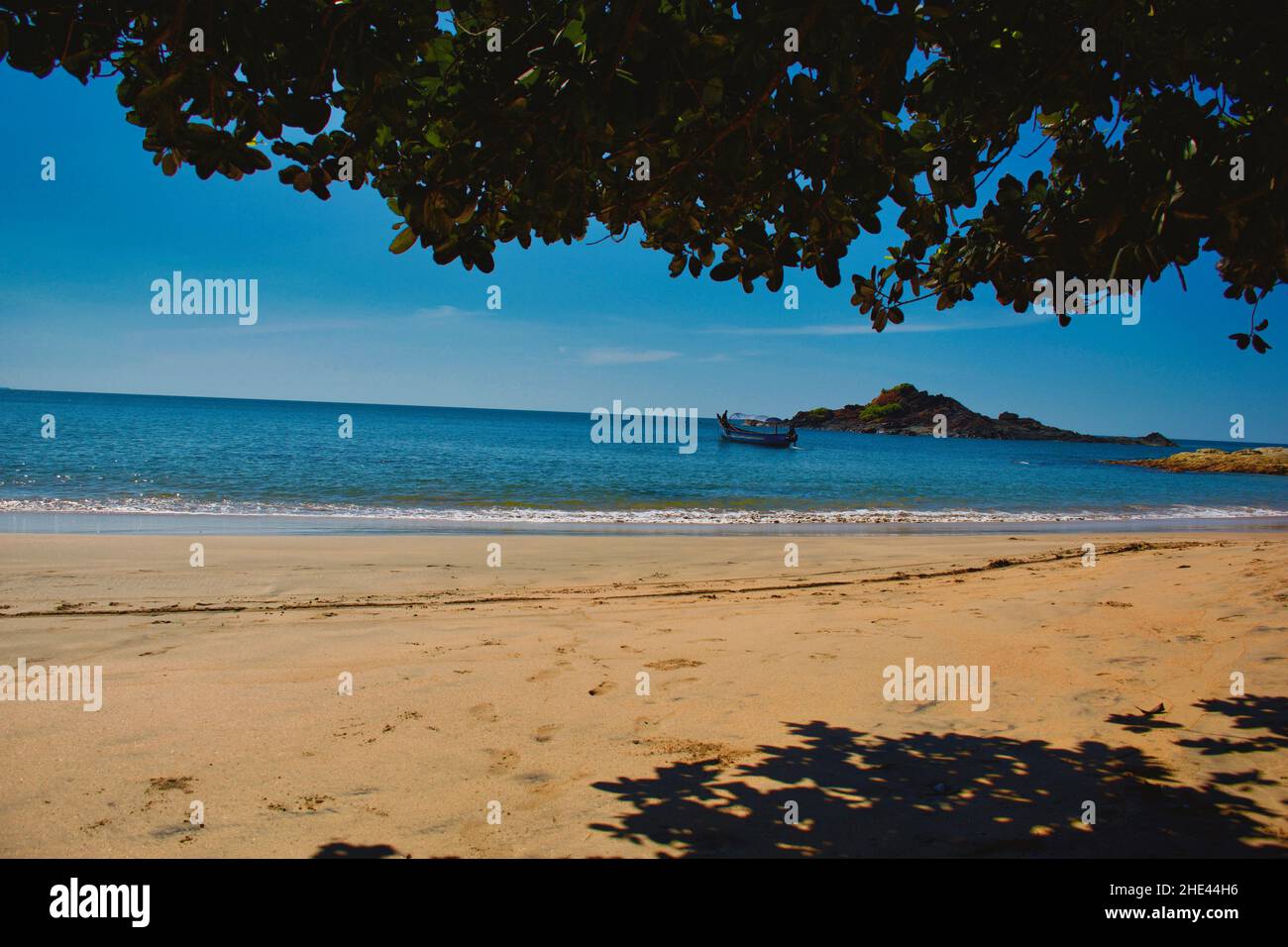 Under the shade on the beach Stock Photo - Alamy