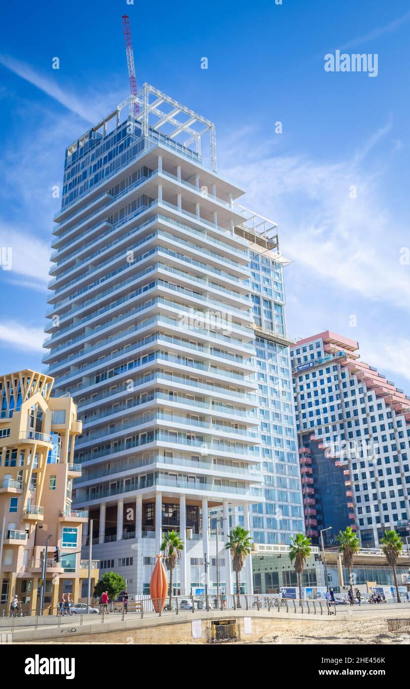Skyscraper at the Tel Aviv Mediterranean beach. Cityscape with sandy ...