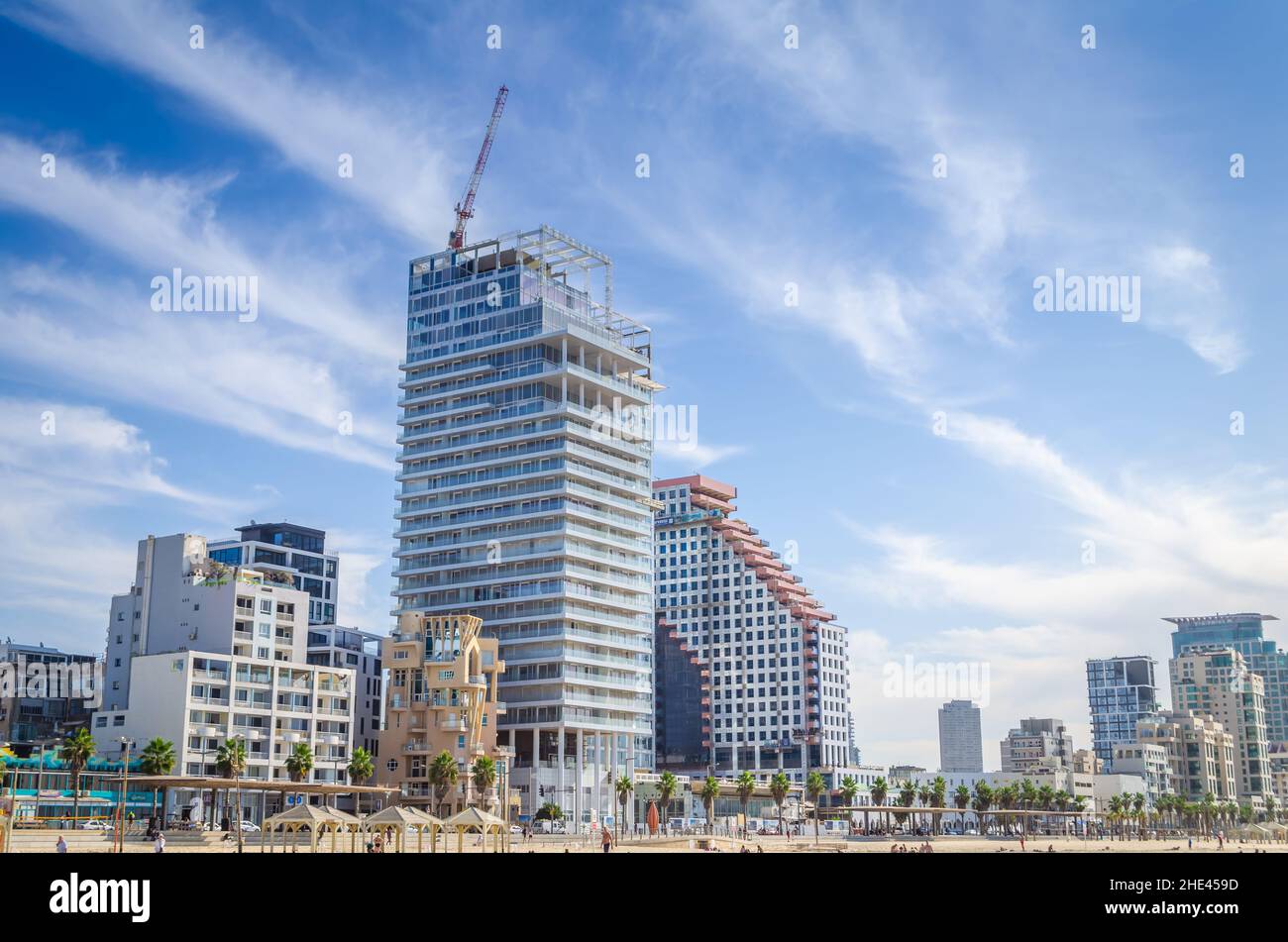 Skyscraper at the Tel Aviv Mediterranean beach. Cityscape with sandy ...