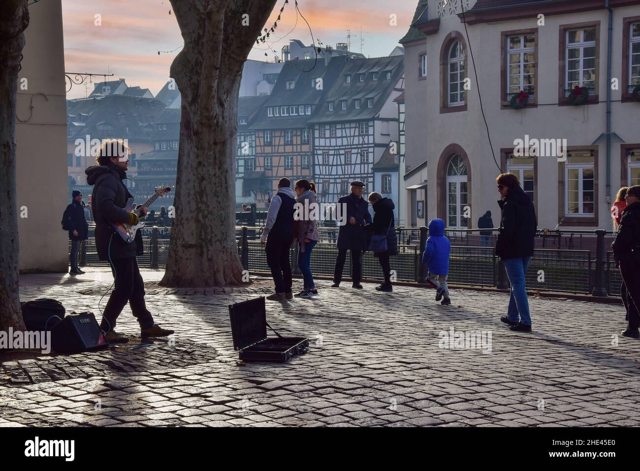 Street performer, singer, artist giving a public concert in Strasbourg ...