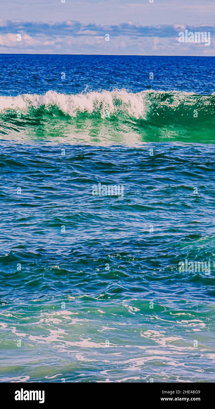 A vertical shot of soft ocean waves with foam Stock Photo - Alamy