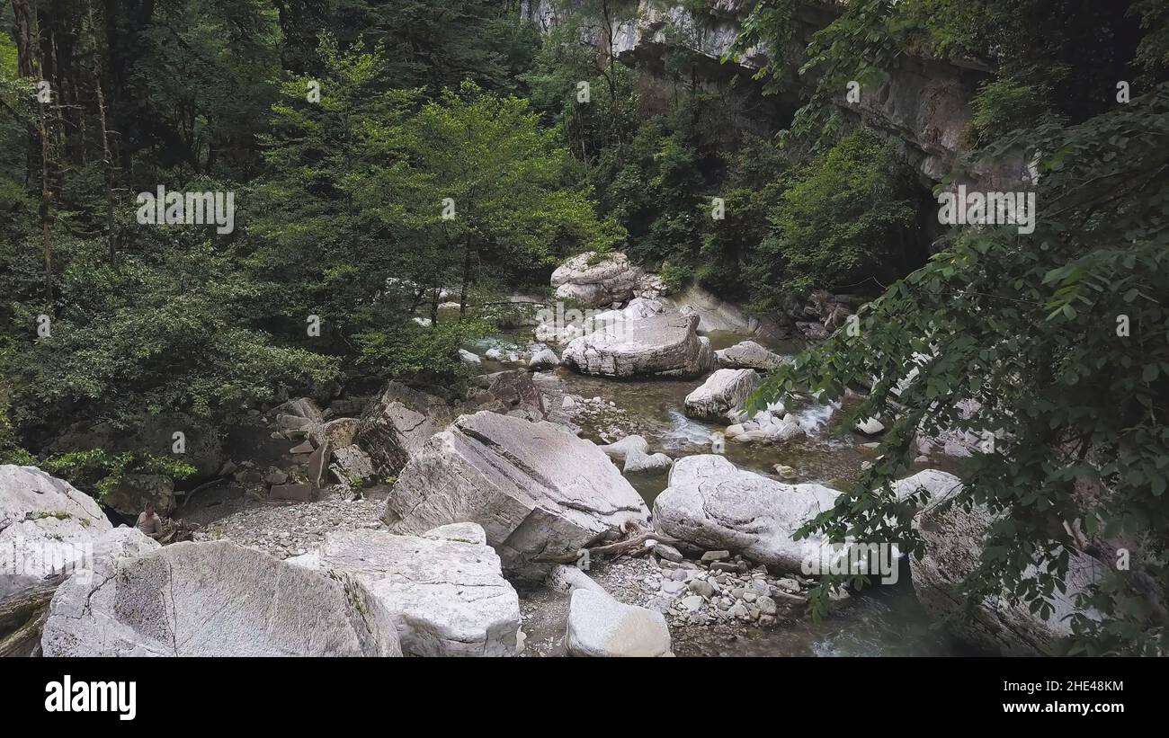 Wild nature landscape of the river in the mountains surrounded by a ...