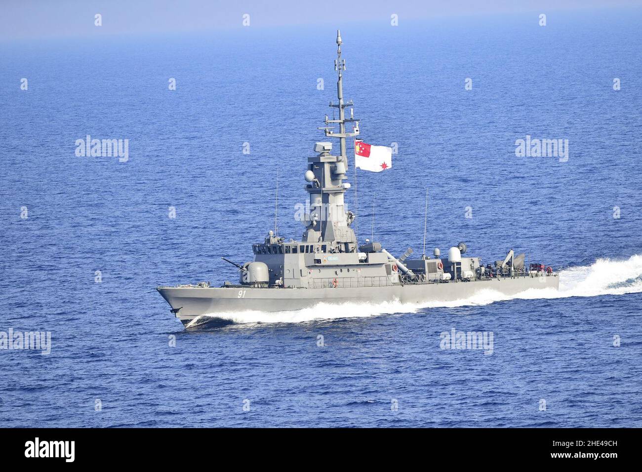 RSS Valiant sails next to the aircraft carrier USS Theodore Roosevelt ...