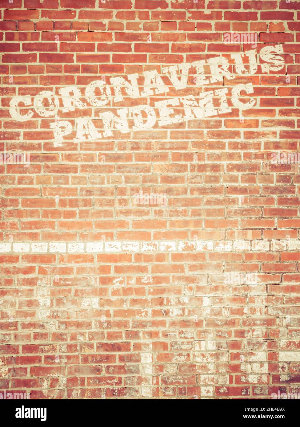 Sign "Coronavirus Pandemic"on brick wall never going away Stock Photo ...