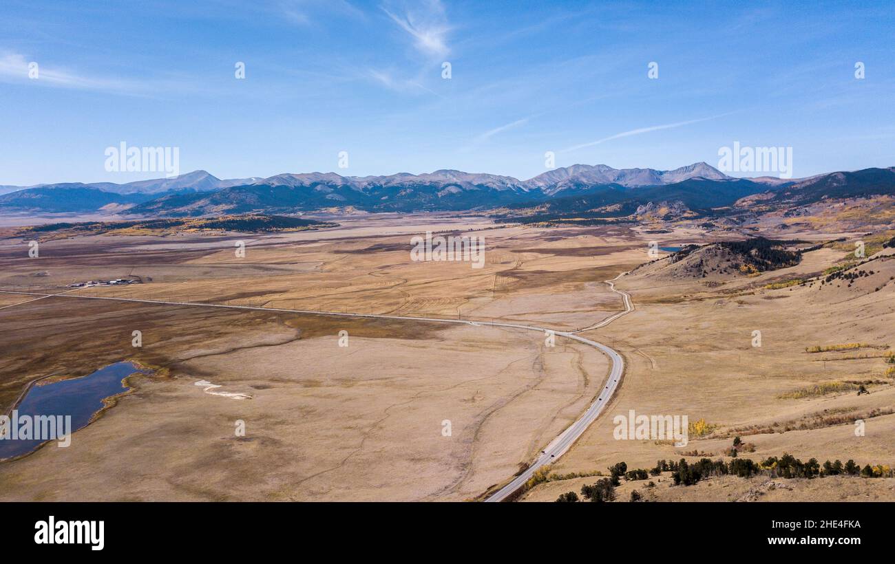 Aerial view of a deserted area in the background of the Rockies, near ...