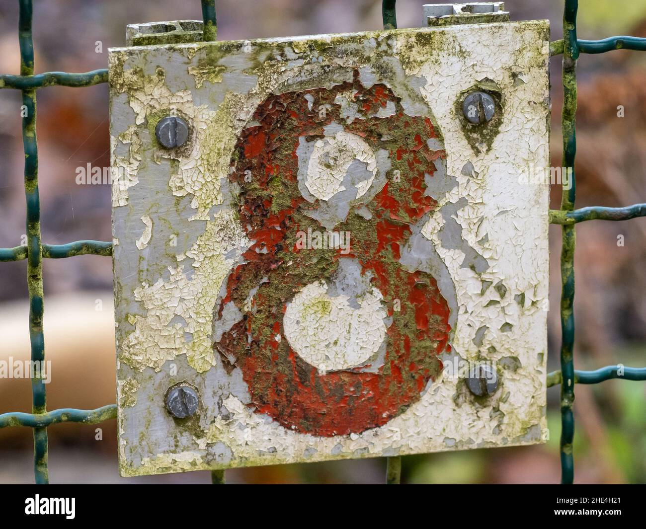 House number eight on sign on fence Stock Photo - Alamy