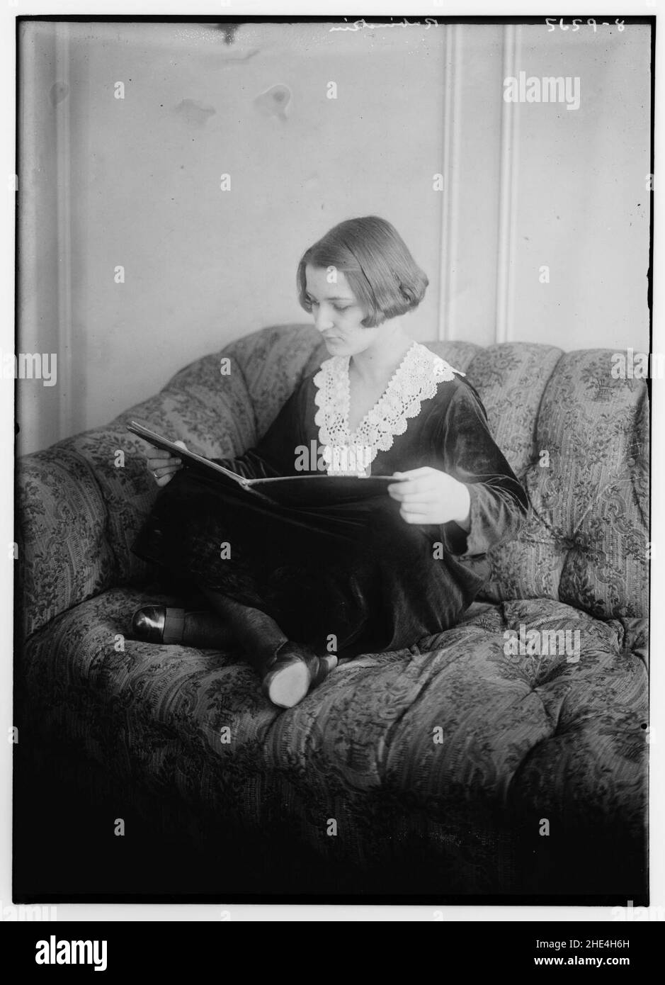 Seated on couch Black and White Stock Photos & Images - Alamy