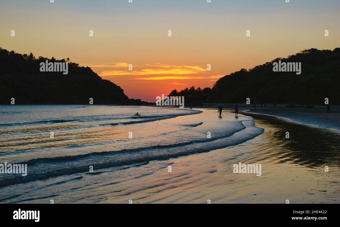 Sunset on the beaches of Goa Stock Photo - Alamy