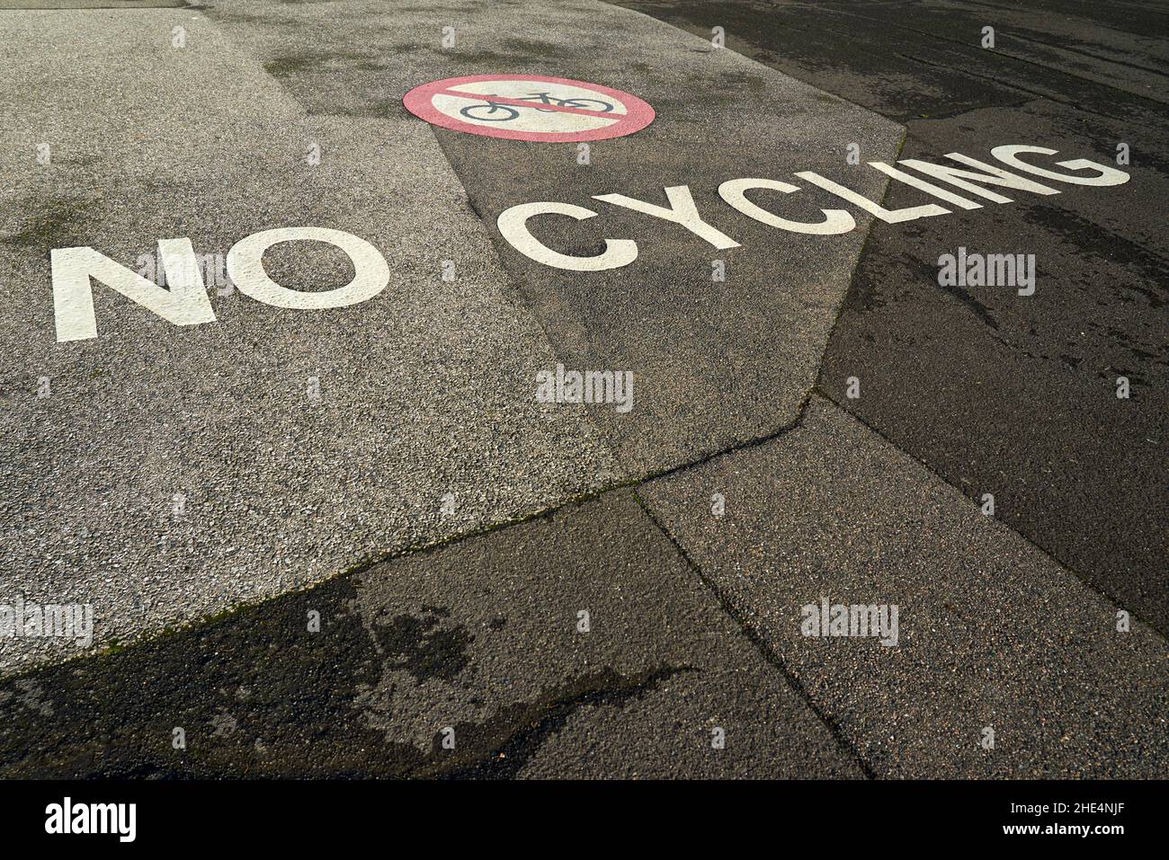 Sign of no cycling and a white text of no cycling on the ground of an ...