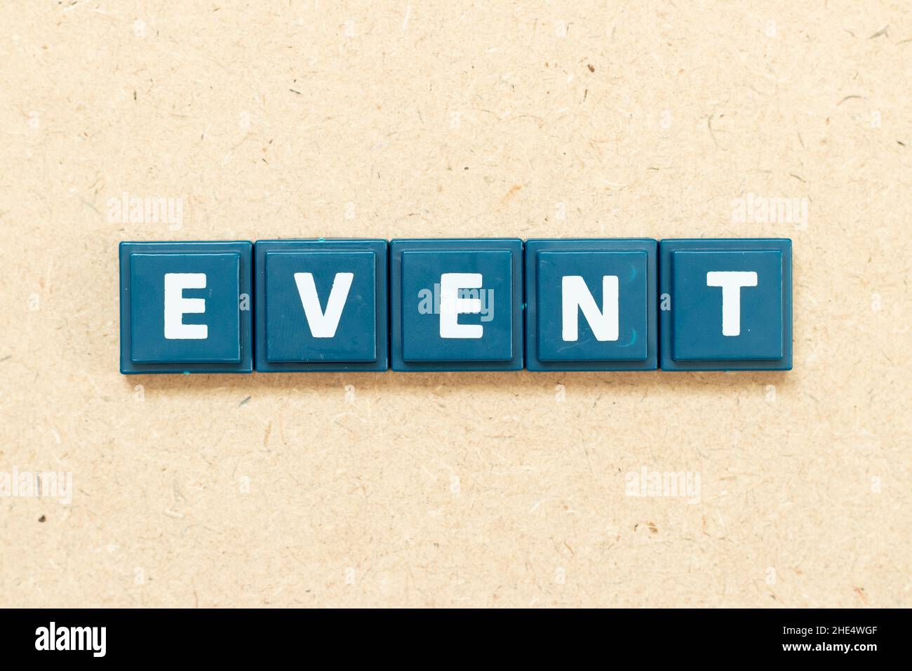 Tile alphabet letter in word event on wood background Stock Photo - Alamy