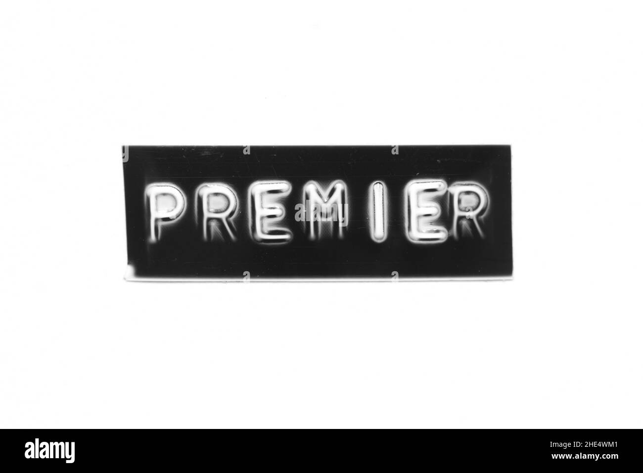 Black color banner that have embossed letter with word premier on white ...