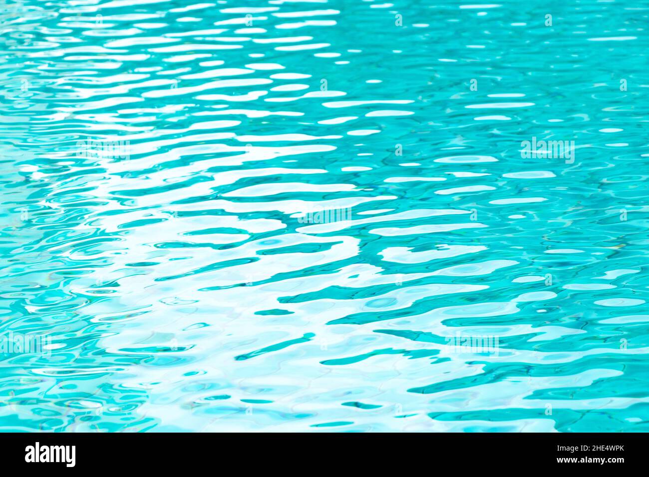 Ripple Water in swimming pool with blue tile floor background Stock ...