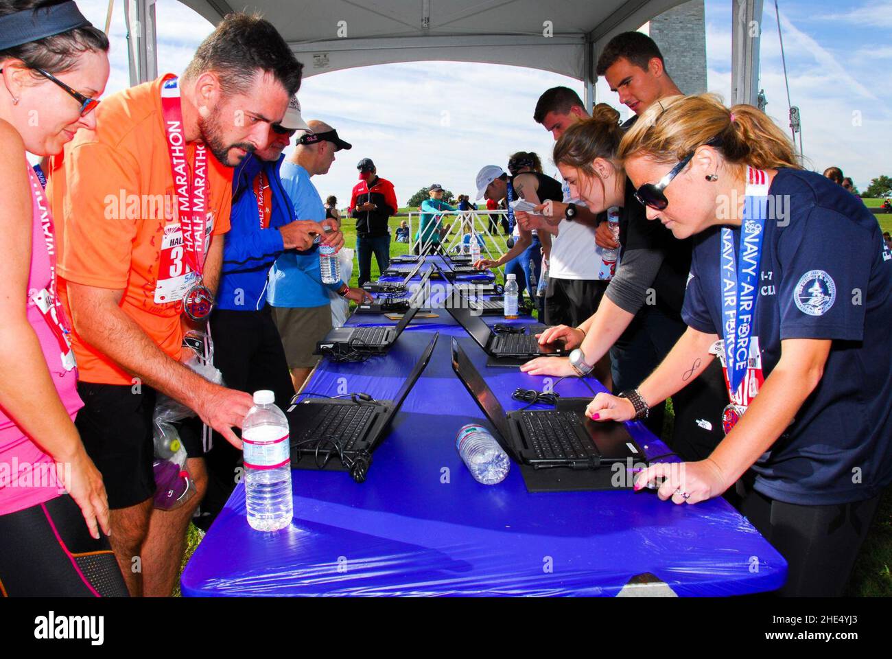 Runners check their times after Half-Marathon 140914 Stock Photo - Alamy