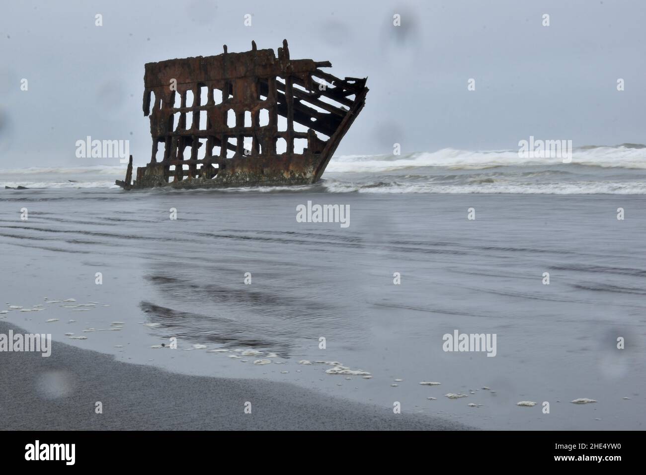 Wreck of the Peter Iredale during a storm on Delaura Beach in Fort ...