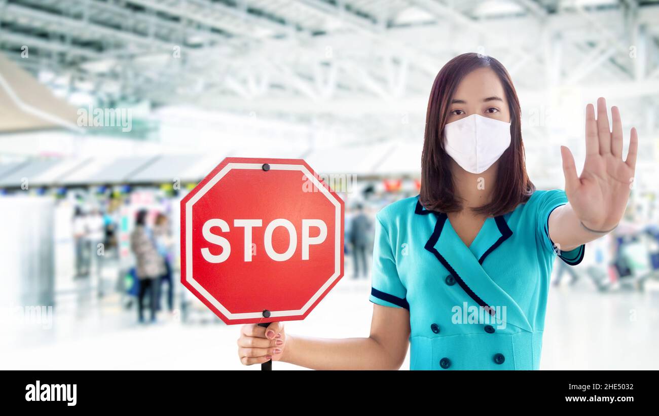 Asian woman open hand on stop action and show banner stop sign for ...